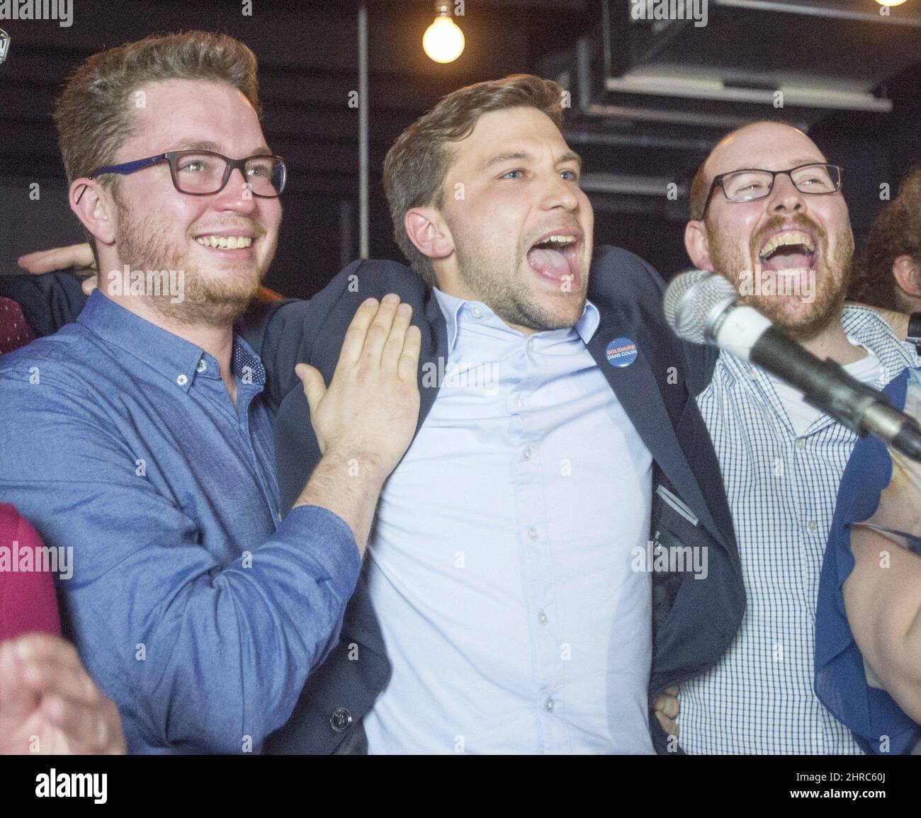 Quebec Solidaire candidate Gabriel Nadeau-Dubois, centre, reacts after ...