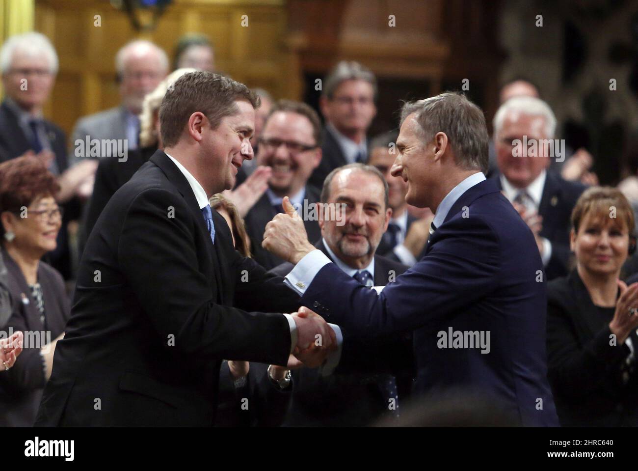 Conservative MP Maxime Bernier(right)gives the thumbs up to ...