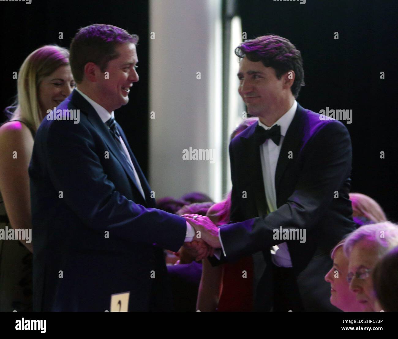 Prime Minister Justin Trudeau (right) shakes hands with Conservative ...