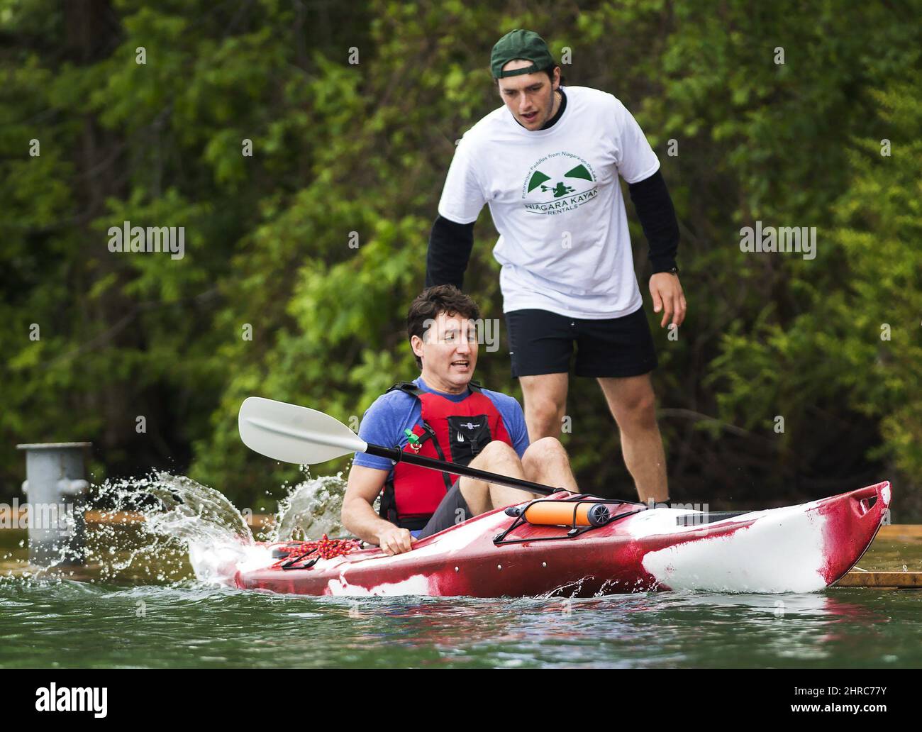 Prime Minister Justin Trudeau gets into a kayak as he prepares to ...