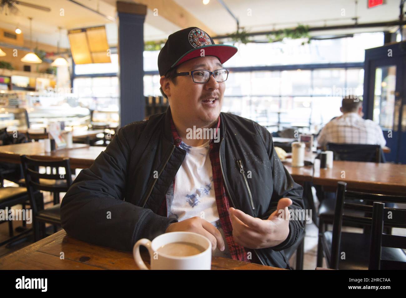 Indigenous poet Jordan Abel is shown during an interview with The ...