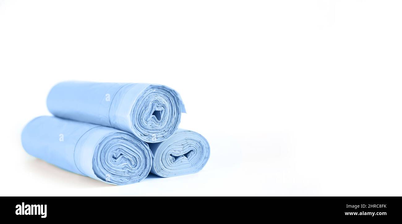 Three rolls of blue biodegradable plastic bags isolated on white ...