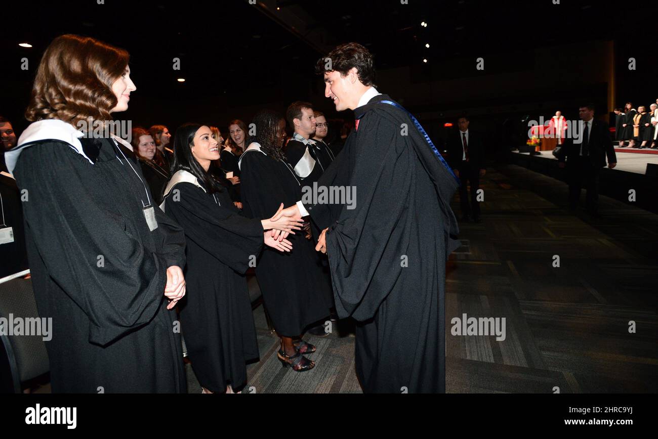Prime Minister Justin Trudeau shakes hands with graduates after ...