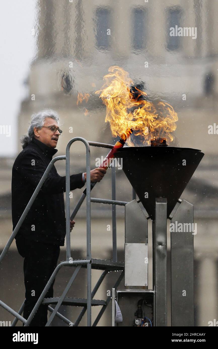 Elder Dave Courchene, carrying a sacred fire torch carried from Manitou ...