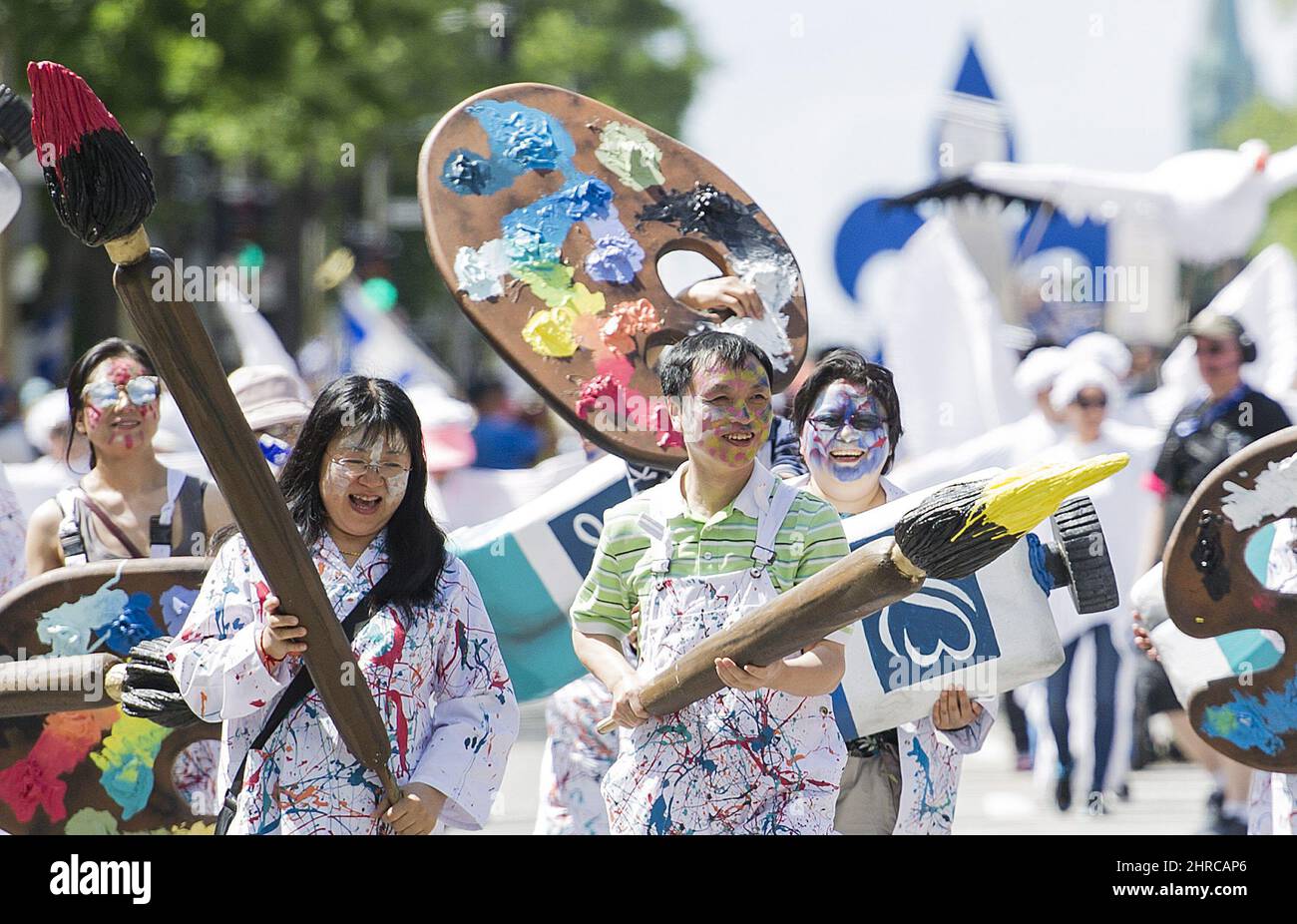 Participants entertain the crowd during the annual Saint-Jean-Baptiste ...