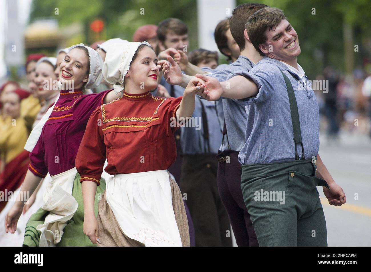 Participants entertain the crowd during the annual Saint-Jean-Baptiste ...
