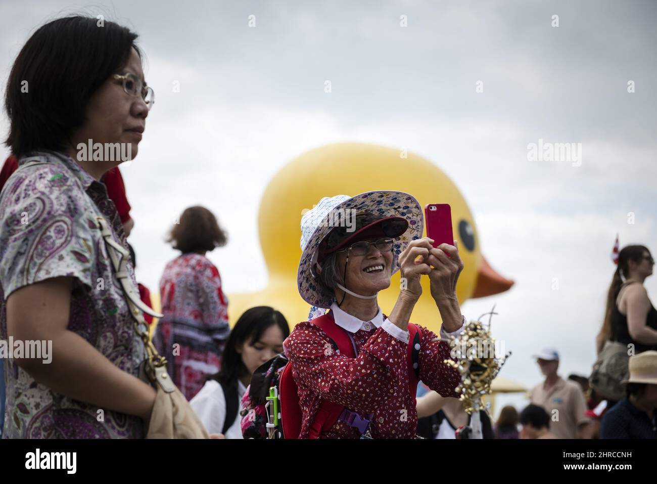 People celebrate Canada Day near the giant inflatable duck that sits on ...