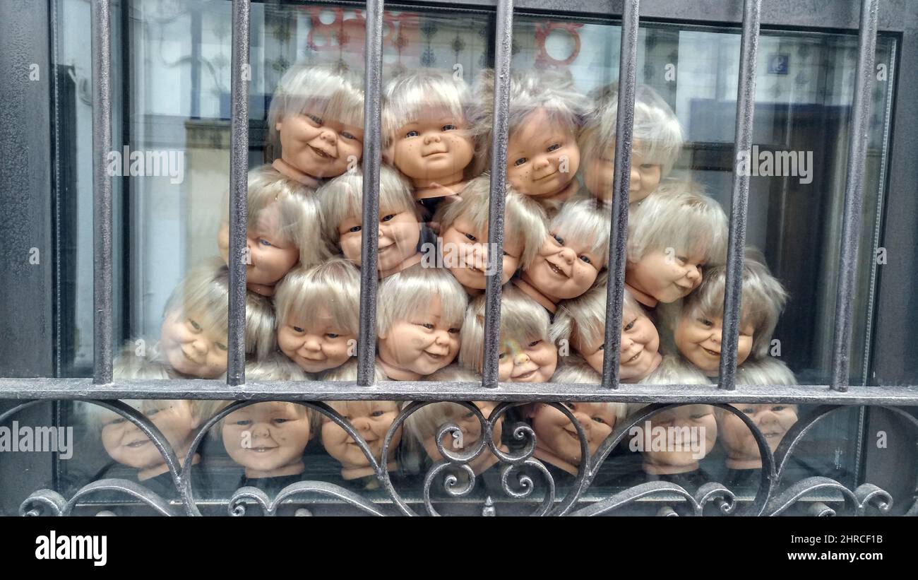 Broken doll heads stacked on top of each other Stock Photo - Alamy