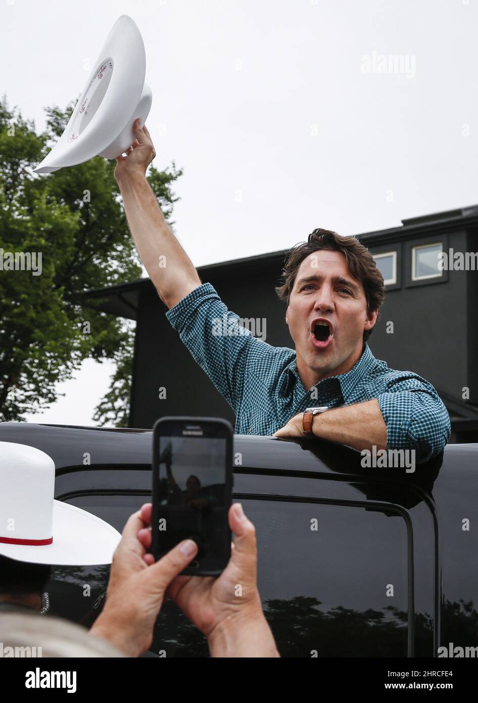 Prime Minister Justin Trudeau waves goodbye to onlookers at a Stampede ...