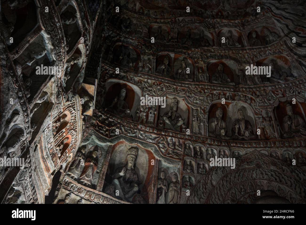 Buddhist statues in the Chinese Yungang Grottoes temple of Datong City ...