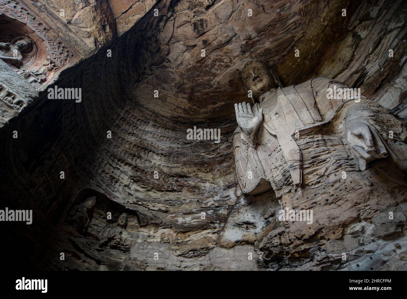Buddhist statues in the Chinese Yungang Grottoes temple of Datong City ...
