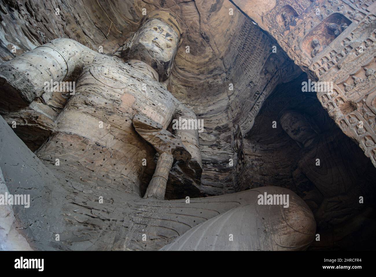 Buddha statues in the Chinese Yungang Grottoes temple of Datong City ...