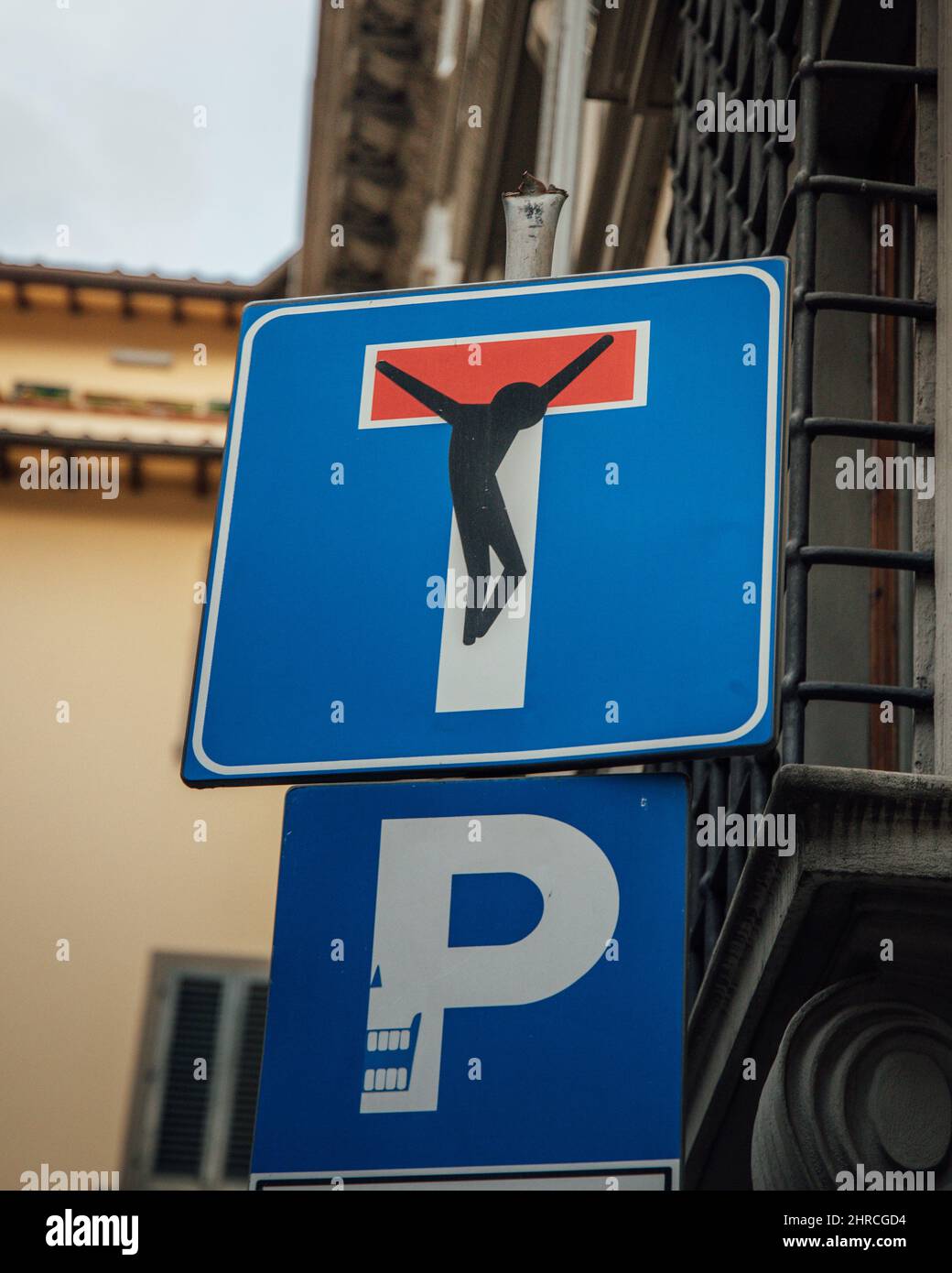 Vertical shot of altered street signs Stock Photo - Alamy