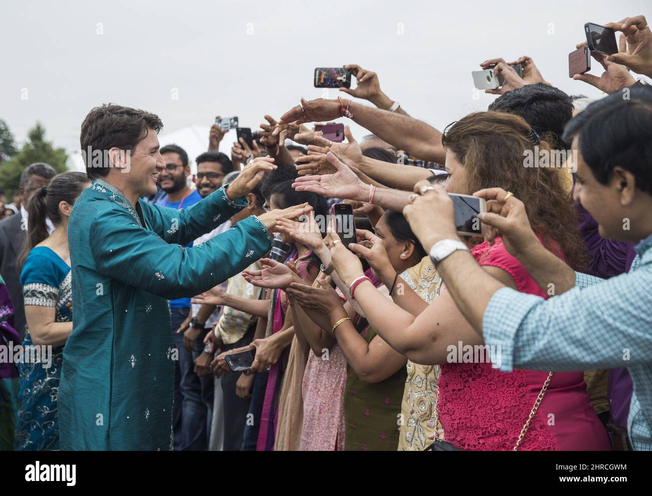 Prime Minister Justin Trudeau greets people as he visits the BAPS Shri ...