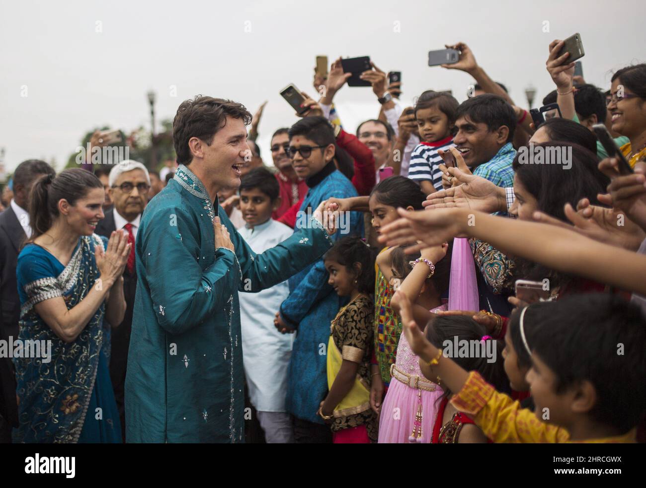 Prime Minister Justin Trudeau greets people as he visits the BAPS Shri ...
