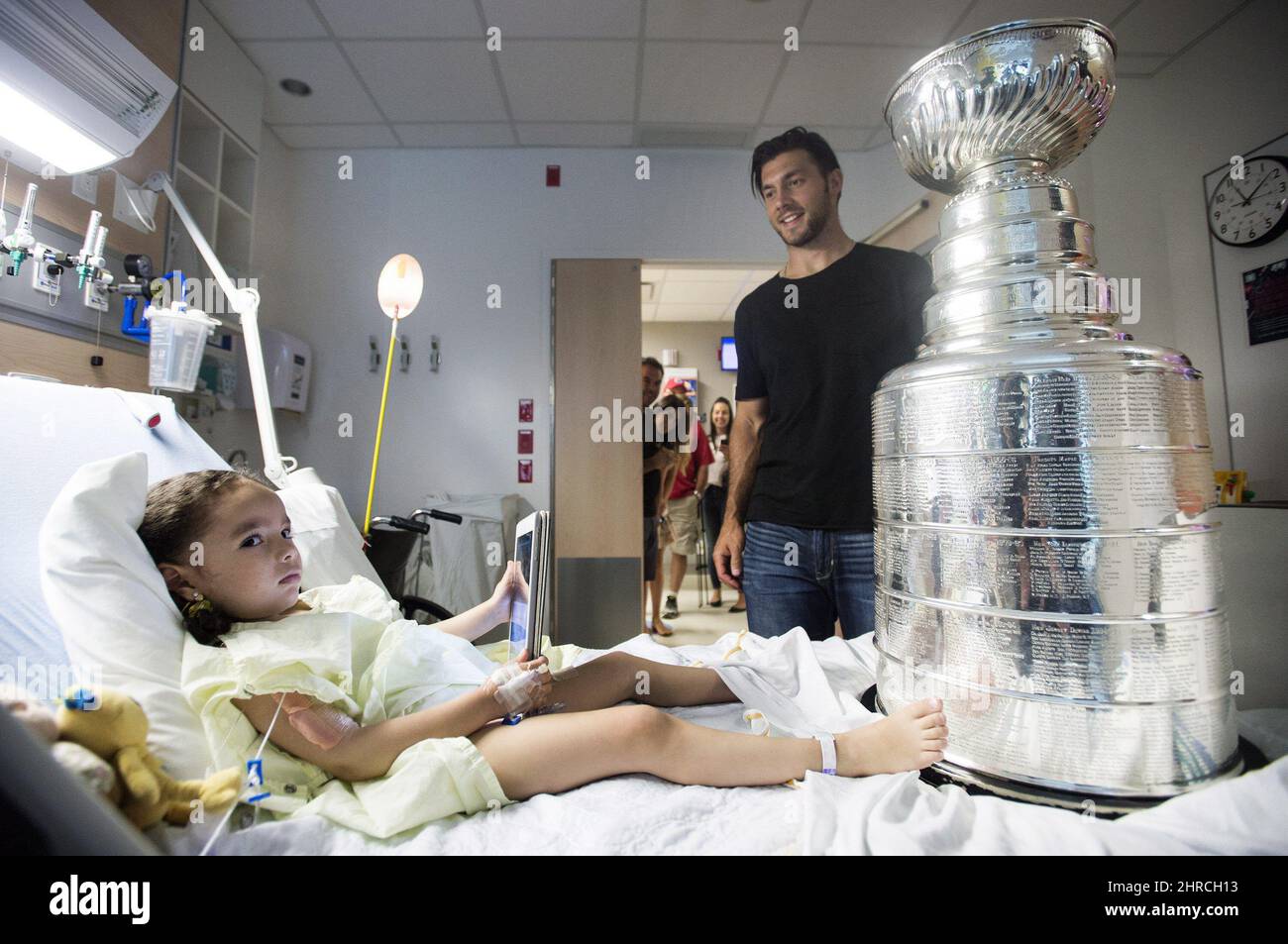 Pittsburgh Penguins' Kris Letang shows off the Stanley Cup to Roya ...