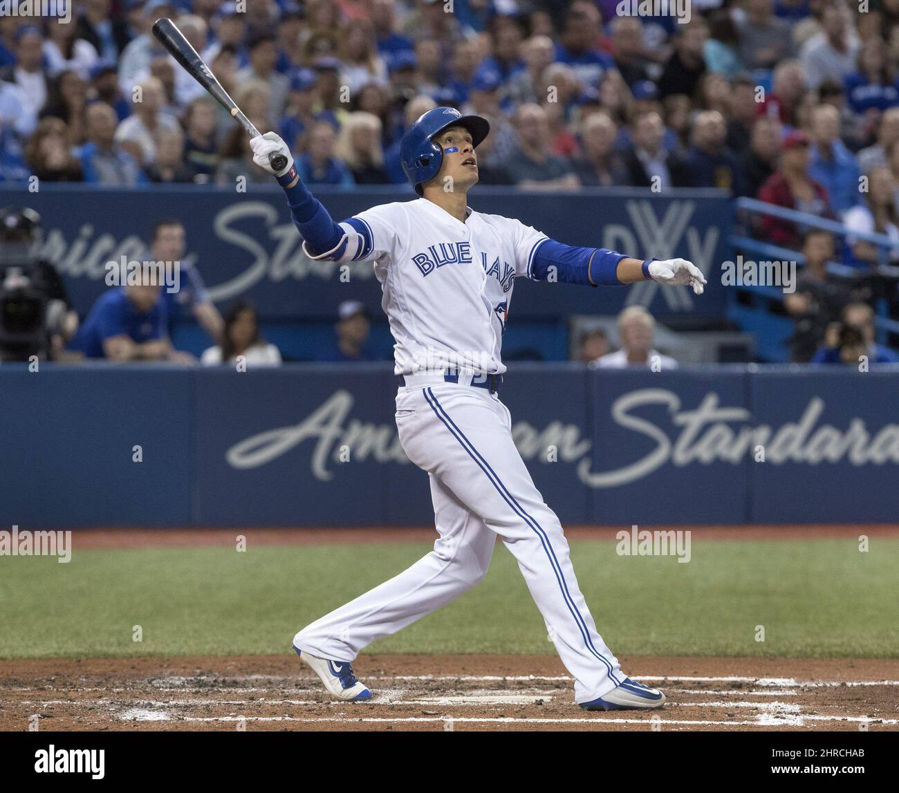 Toronto Blue Jays Ryan Goins watches pop fly drop for a single to drive ...
