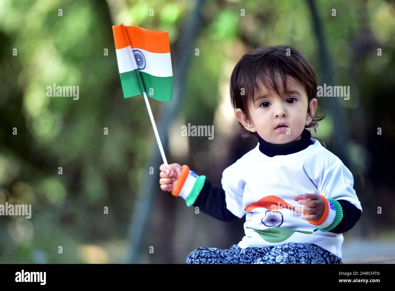 Adorable proud Indian child with an Indian flag and flag shirt Stock ...