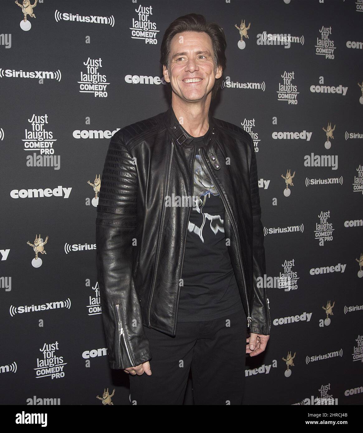 Actor Jim Carrey poses as he arrives for the Just for Laughs awards ...