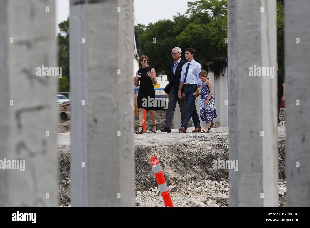 Prime Minister Justin Trudeau walks with Margaret Redman, President and ...