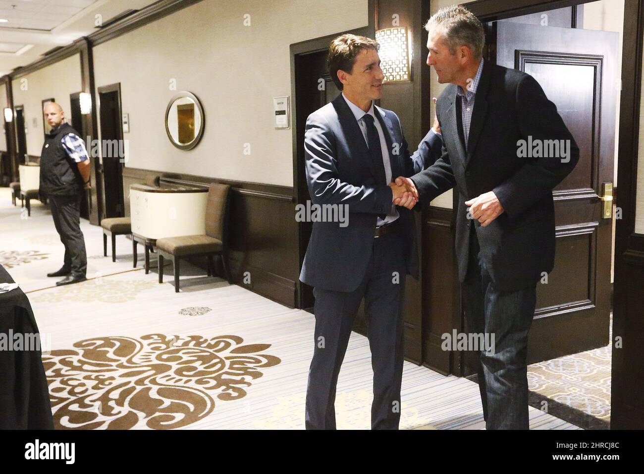 A security officer looks on as Prime Minister Justin Trudeau and ...