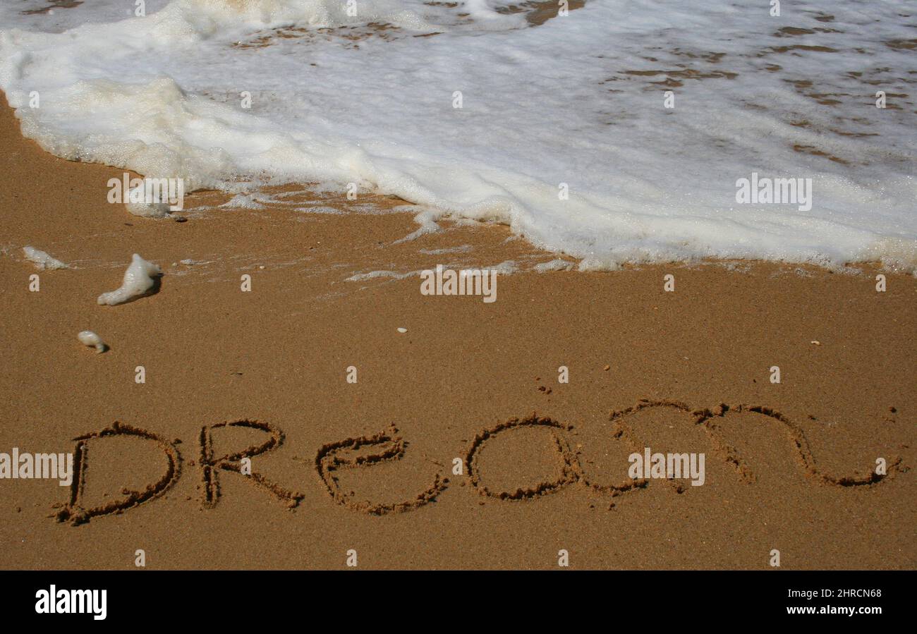 Dream text written on the beach Stock Photo - Alamy