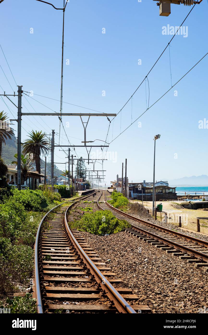 Vertical shot of Railway running through small coastal harbor town of ...