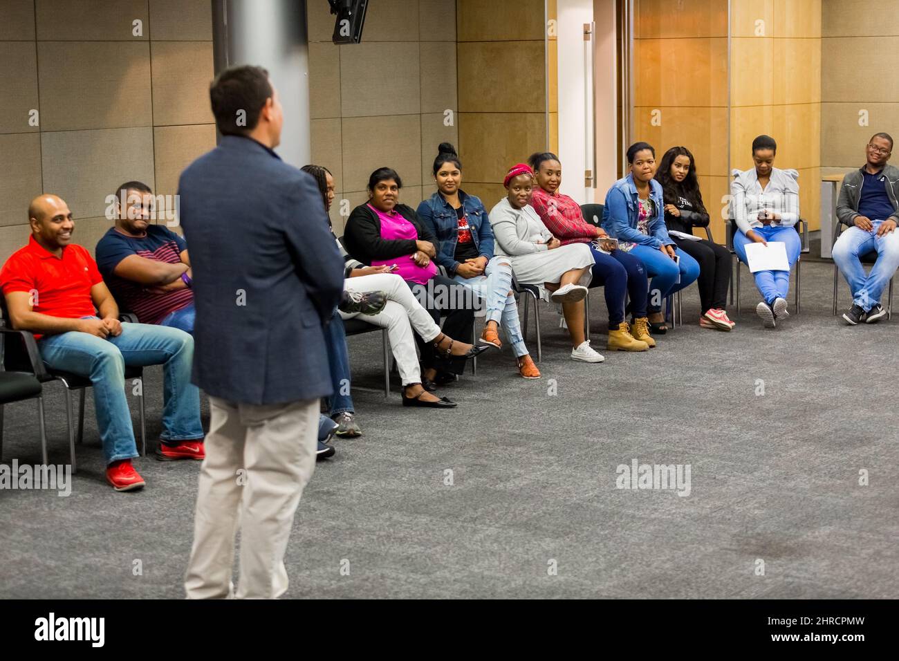 Auditorium of adult students attending a class on finance Stock Photo ...