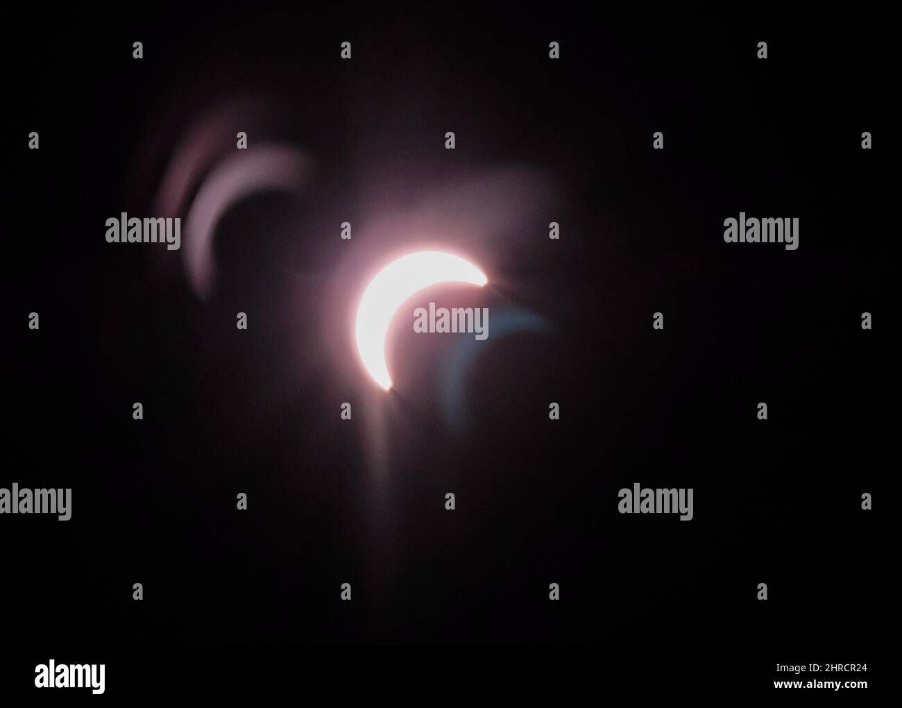 Lens flare creates ghost images in this view of a partial solar eclipse ...