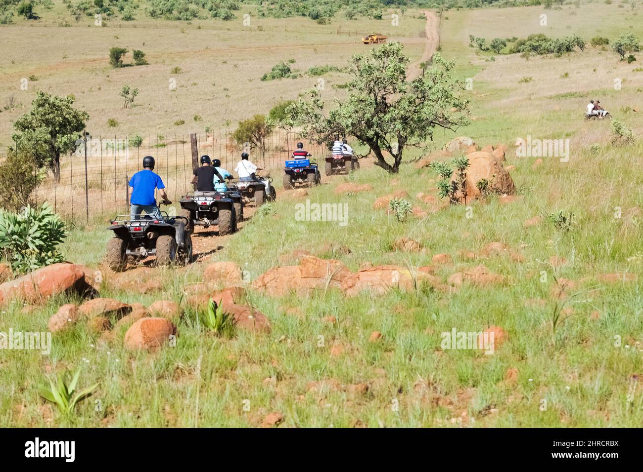 View of Quad bike adventure riding in African bush on dirt roads Stock ...