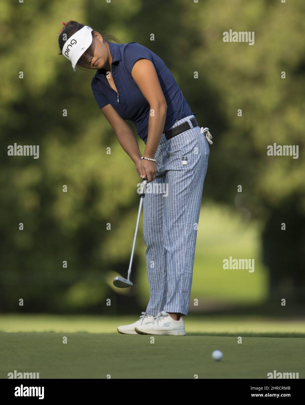Canadian Jennifer Ha putts on the fourth hole during first round play ...