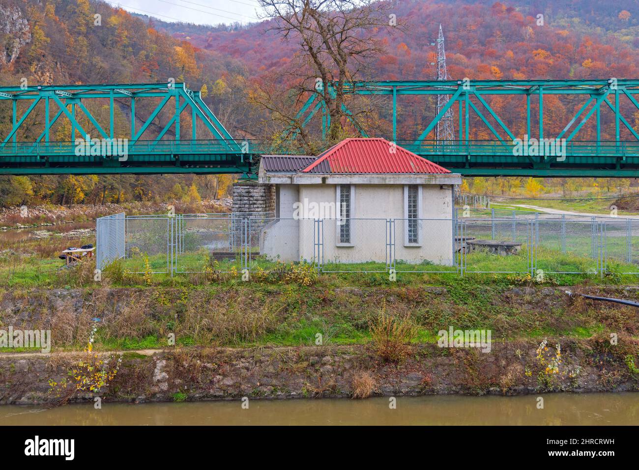 Water Pumping Station at River Under Steel Bridge Stock Photo - Alamy
