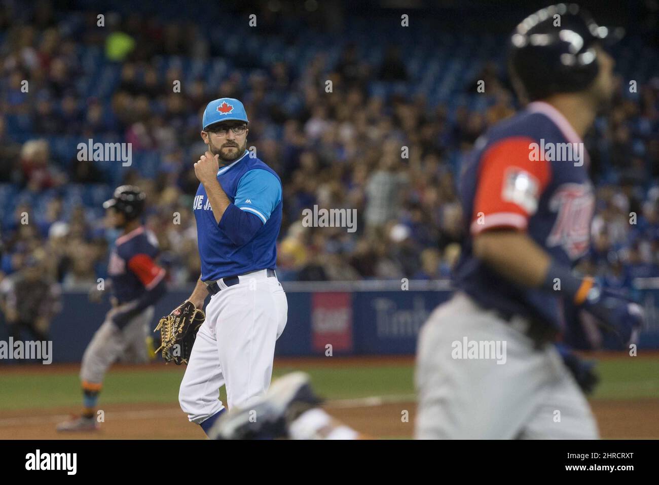 Toronto Blue Jays relief pitcher T.J. House watches the flight of the ...