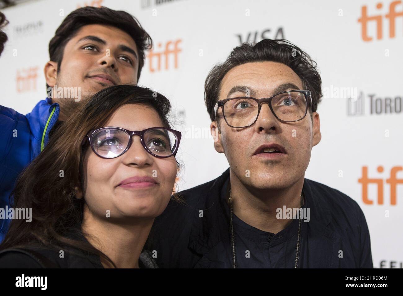 Director Joe Wright, right, looks up as he poses for a photo with fans ...
