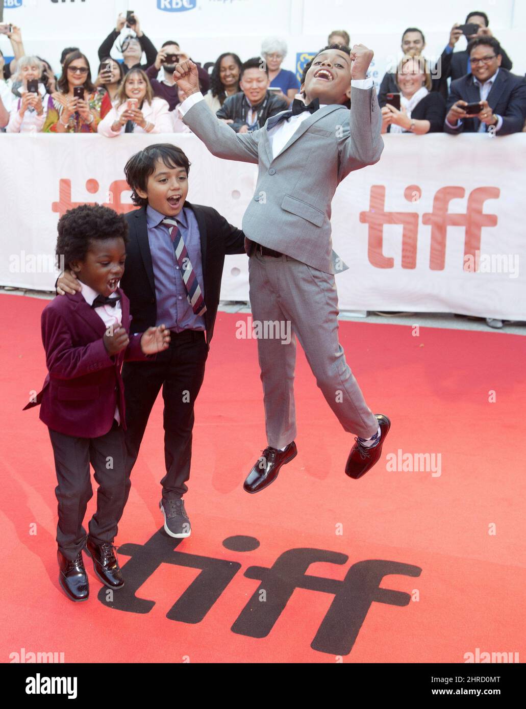 Actors (left to right) Aiden Akpan, Callan Farris and Reece Cody jump ...