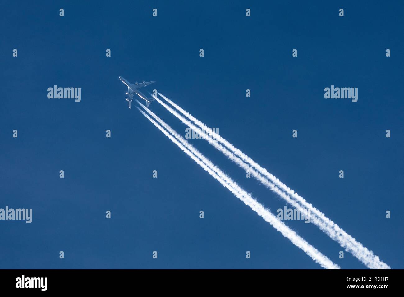 Contrails from a Cargolux Boeing 747 flying at altitude on December ...