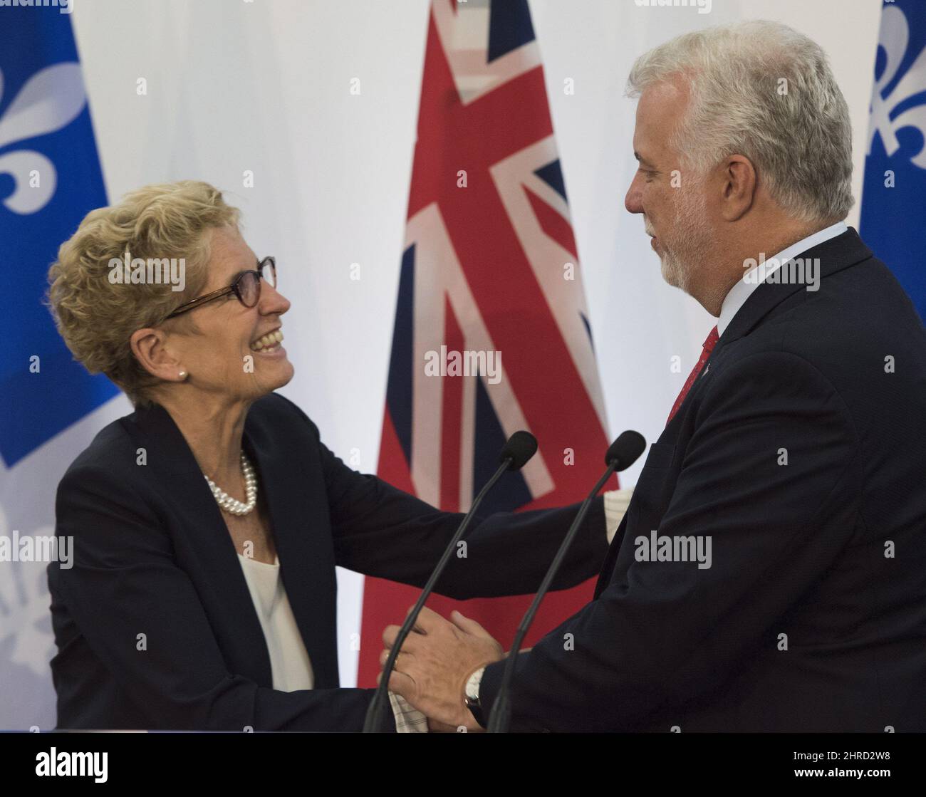 Ontario Premier Kathleen Wynne, left, and Quebec Premier Philippe ...