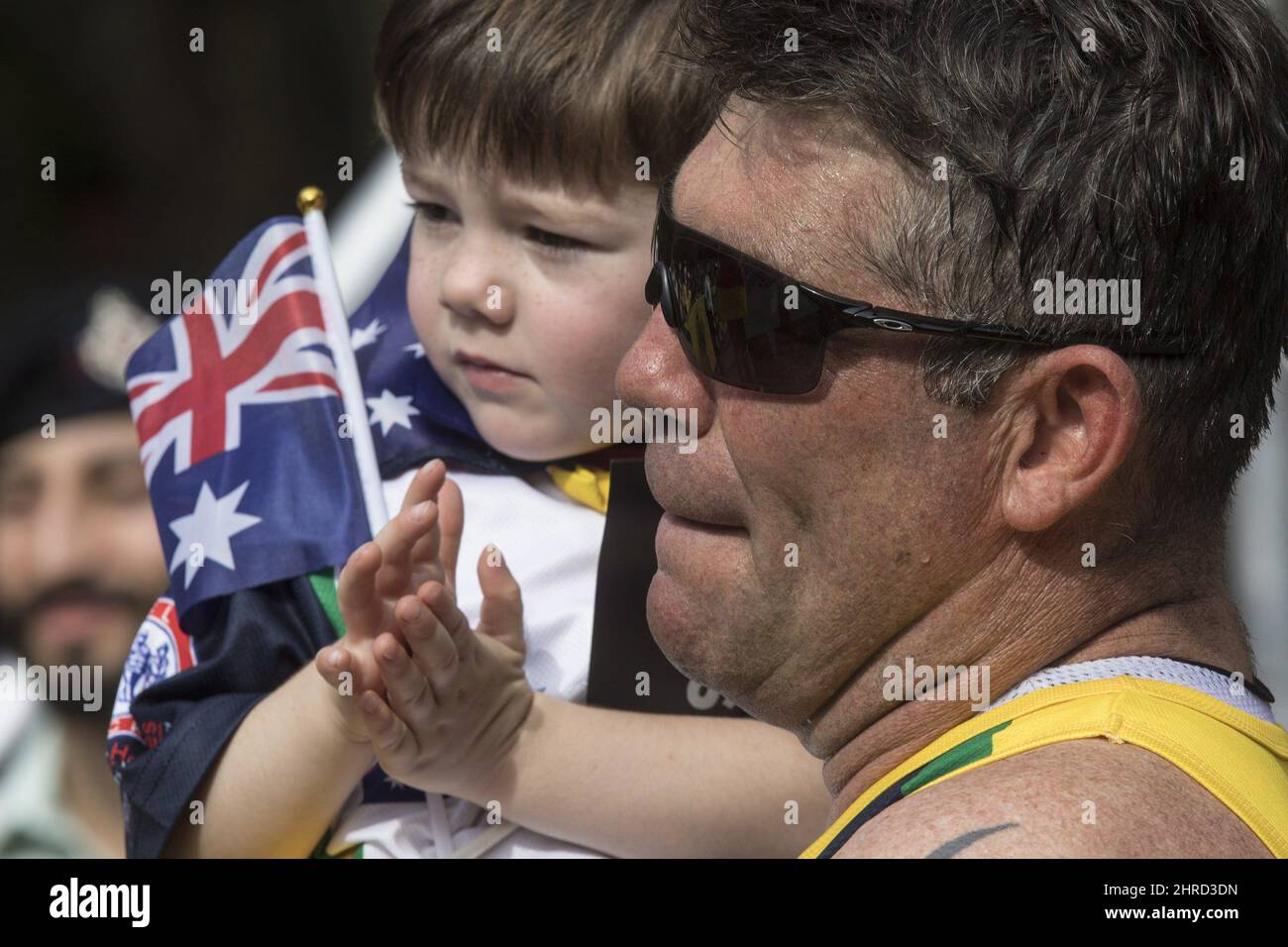 Australia's Mike Rudland holds his three-year-old-son Talon after he ...