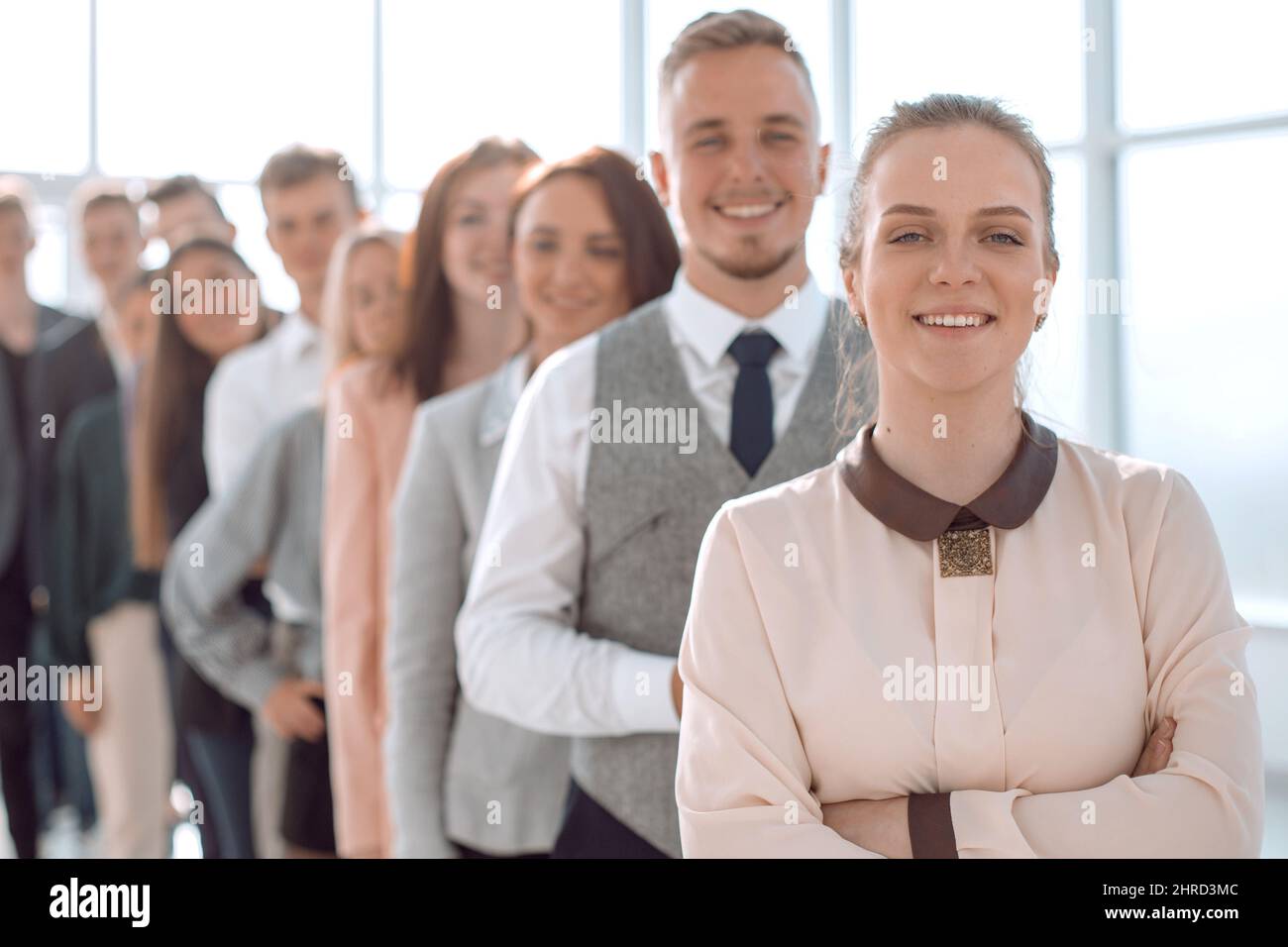 group of diverse young professionals standing in line Stock Photo - Alamy