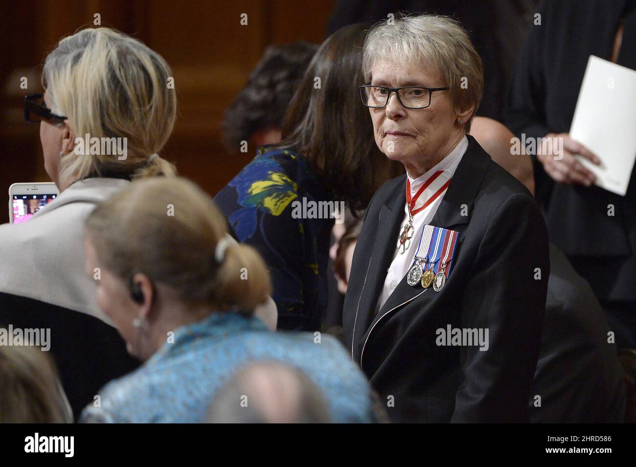 Canada's first female astronaut, Roberta Bondar, takes her seat as guests arrive for the ...