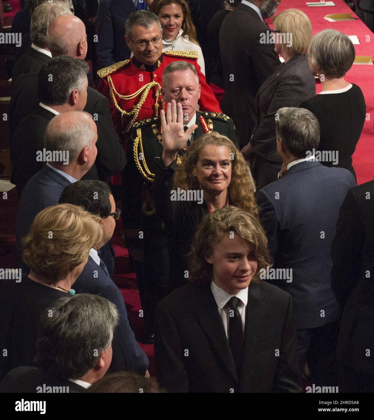 Governor General Julie Payette waves to the gallery as she leaves the Senate with her son ...