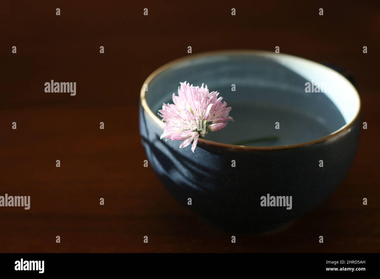 chive flower in a blue bowl Stock Photo - Alamy