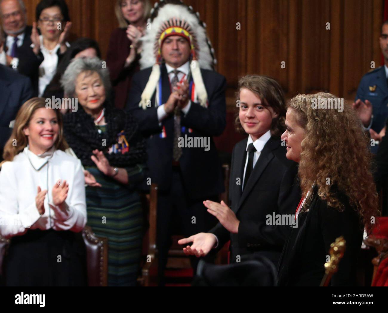 Governor General Julie Payette, right, receives applause from her son Laurier Payette-Flynn ...