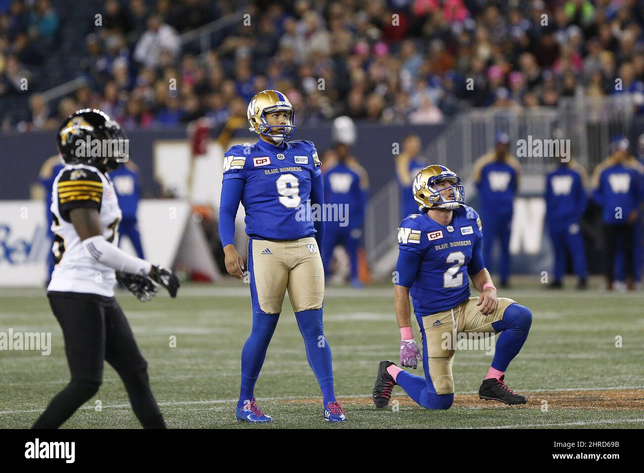 Winnipeg Blue Bombers kicker Justin Medlock (9) and Matt Coates (2 ...