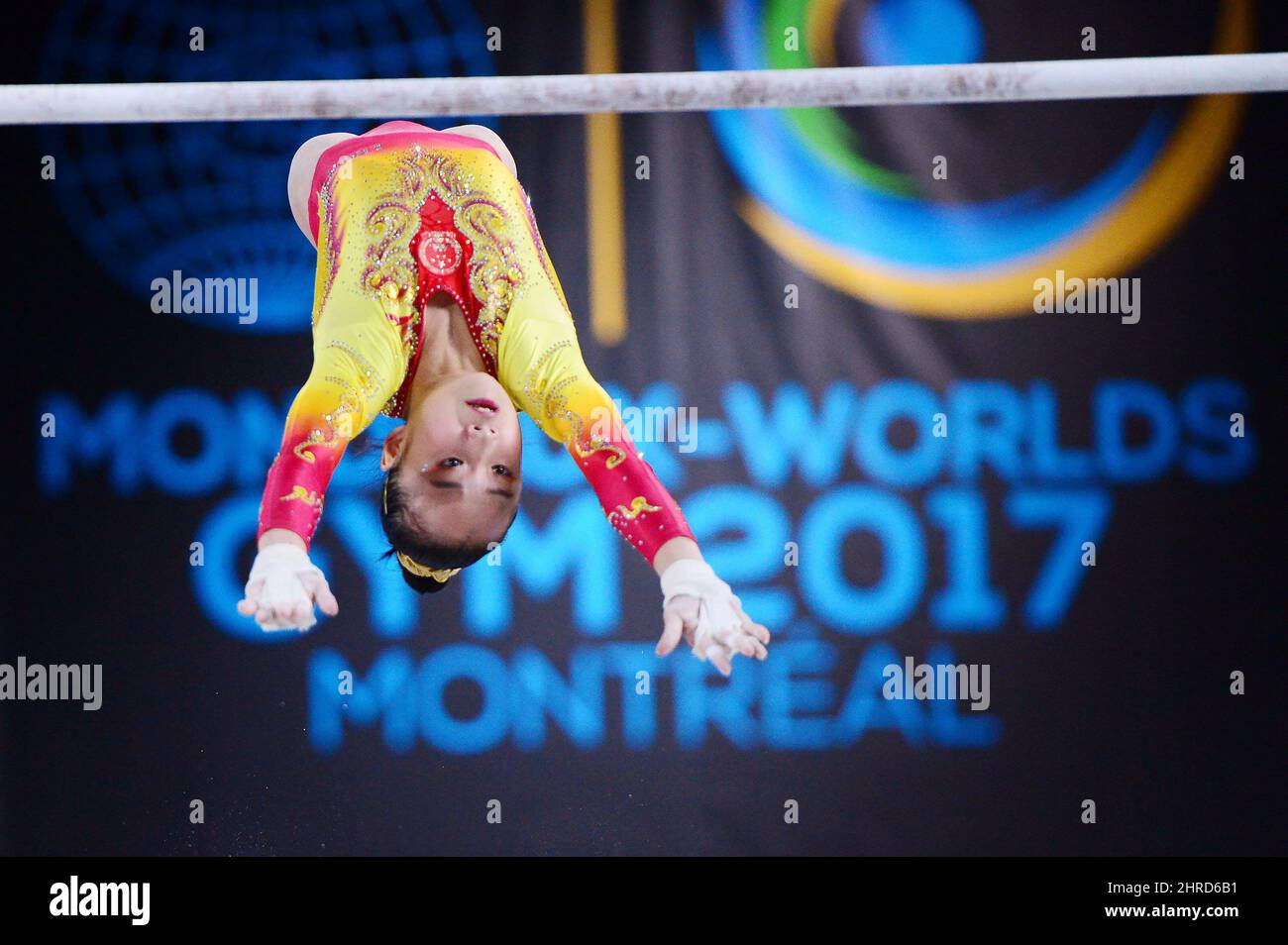 Fan Yilin, of China, performs in the uneven bars event of the women's ...