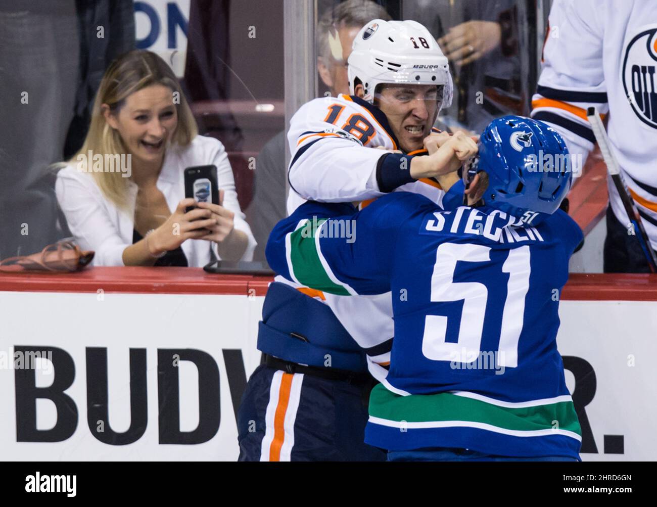 Edmonton Oilers' Ryan Strome (18) and Vancouver Canucks' Troy Stecher ...