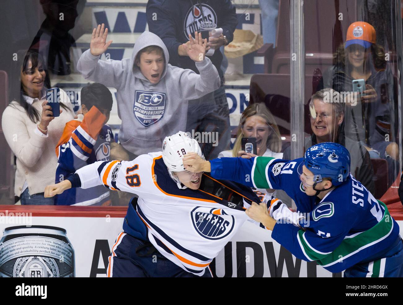 Edmonton Oilers' Ryan Strome, left, and Vancouver Canucks' Troy Stecher ...