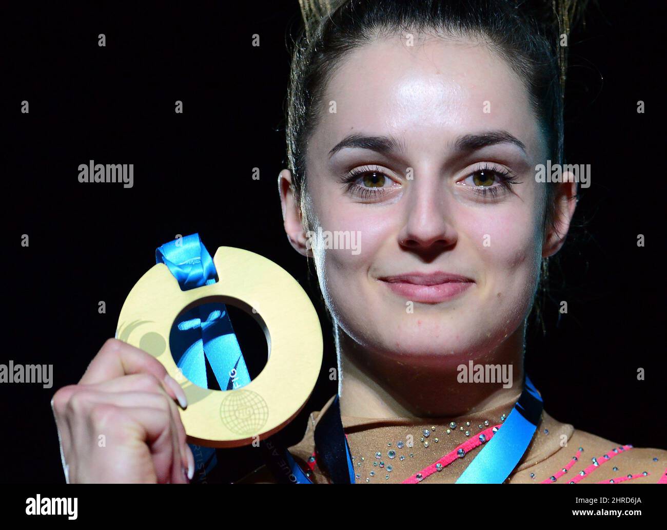 Pauline Schaefer, of Germany, shows off her gold medal in women's ...