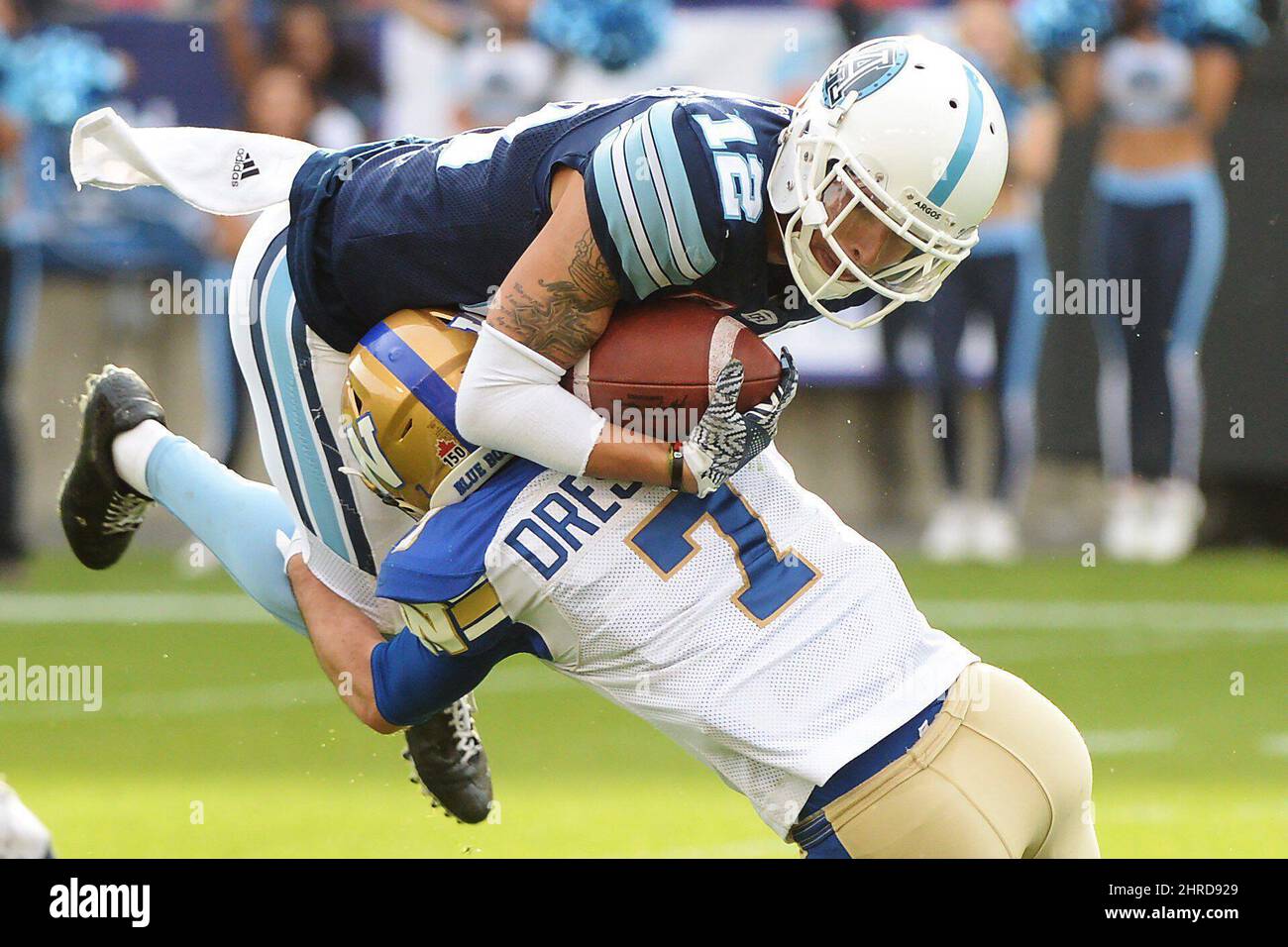 Toronto Argonauts defensive back Mitchell White (12) is tackled by ...