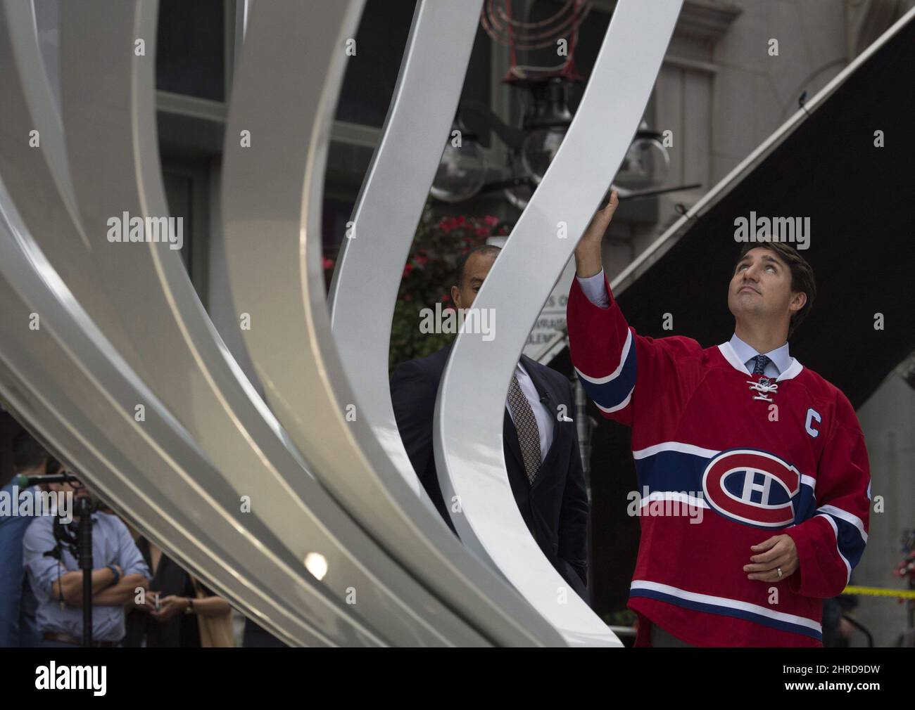 Canadian Prime Minister Justin Trudeau touches the Stanley Cup monument ...